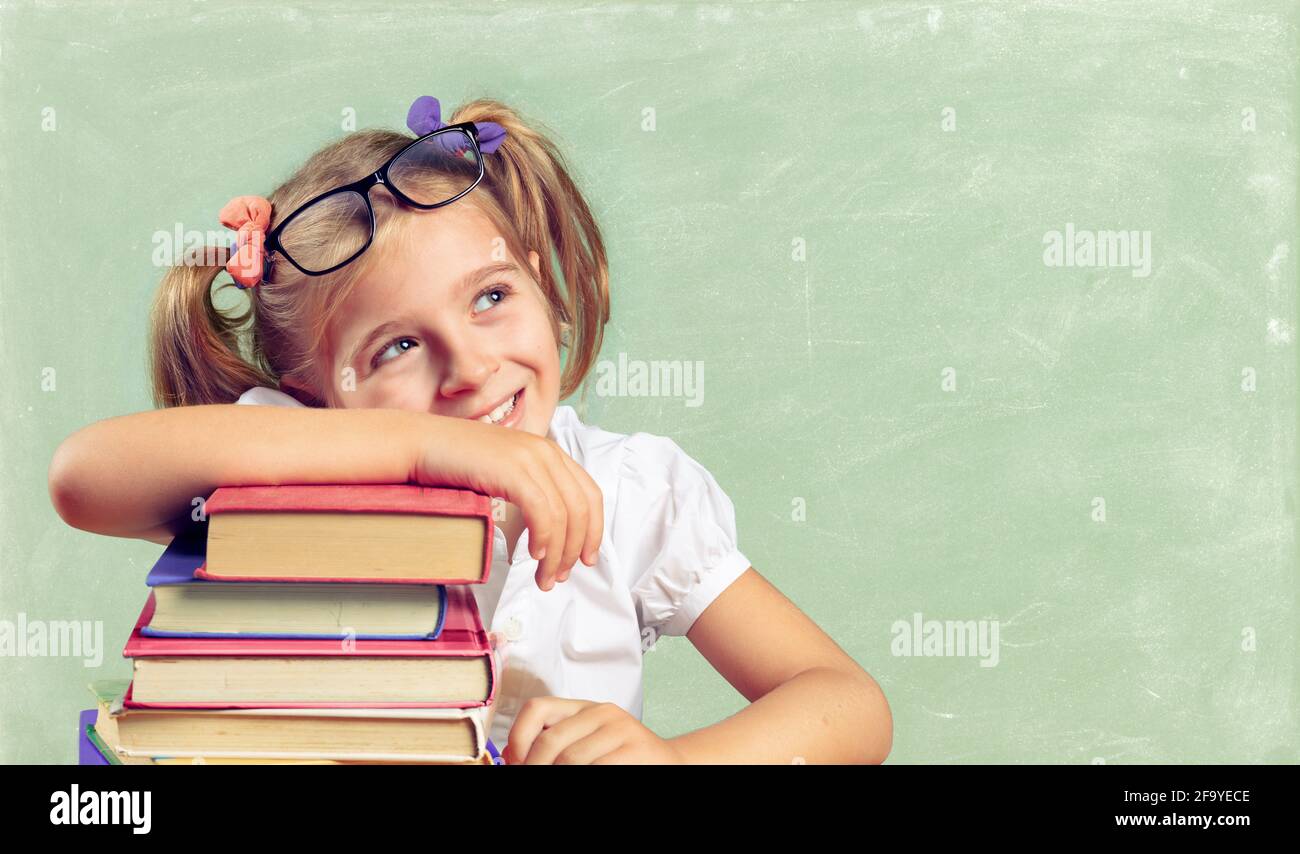 Cute Student With Smile Behind Stack Books Stock Photo - Alamy