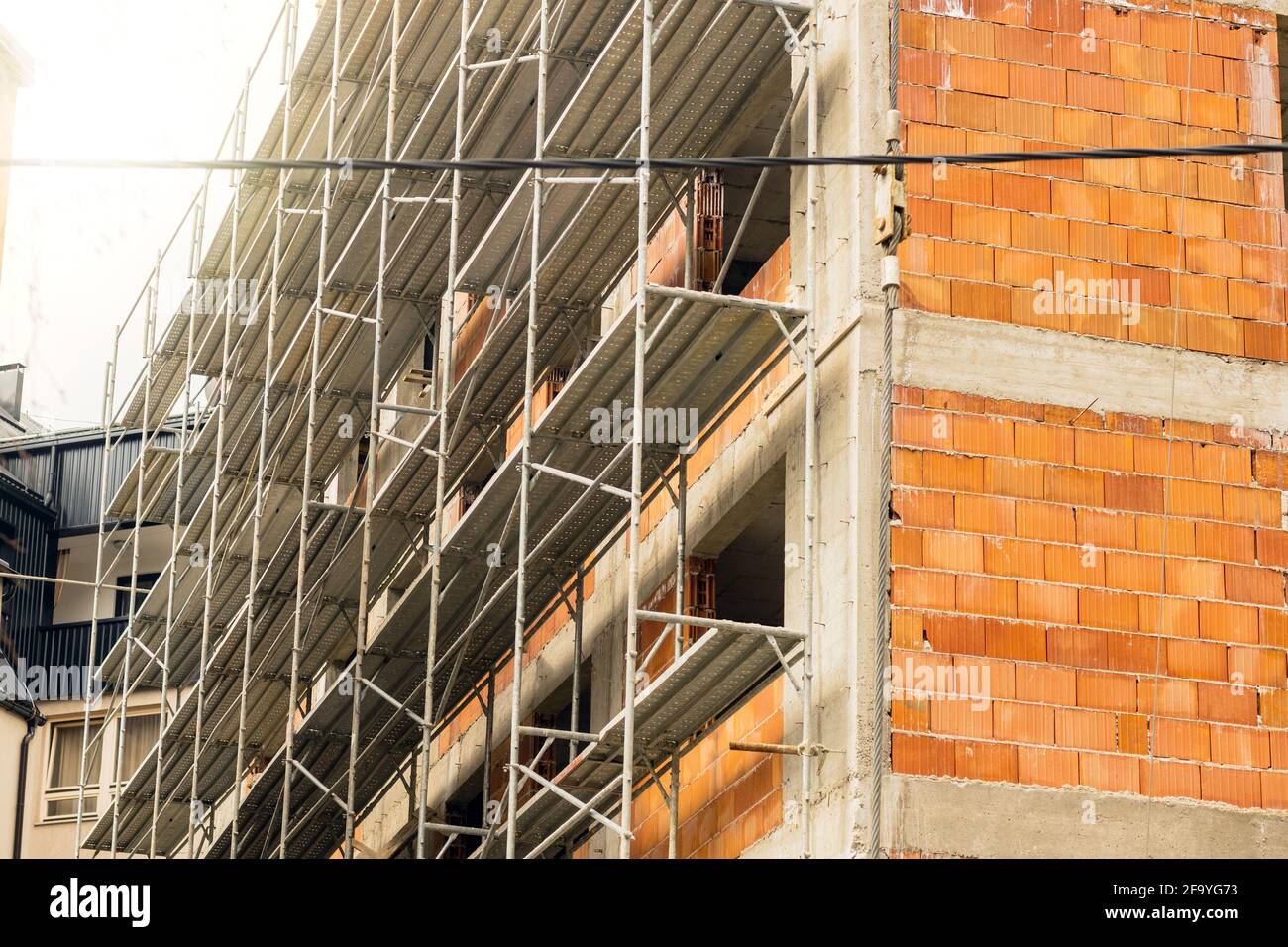 View of a brick-walled building under construction Stock Photo - Alamy