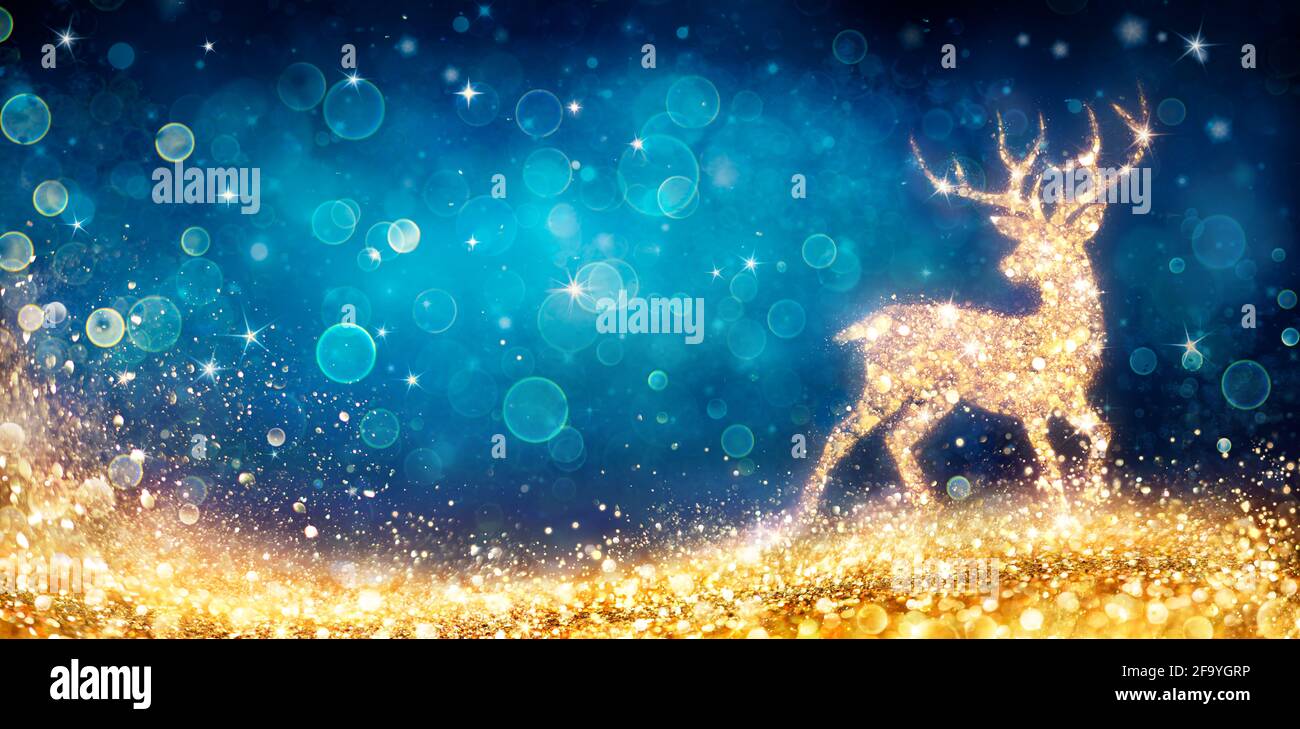 Christmas - Magic Golden Deer In Shiny Blue Background Stock Photo - Alamy