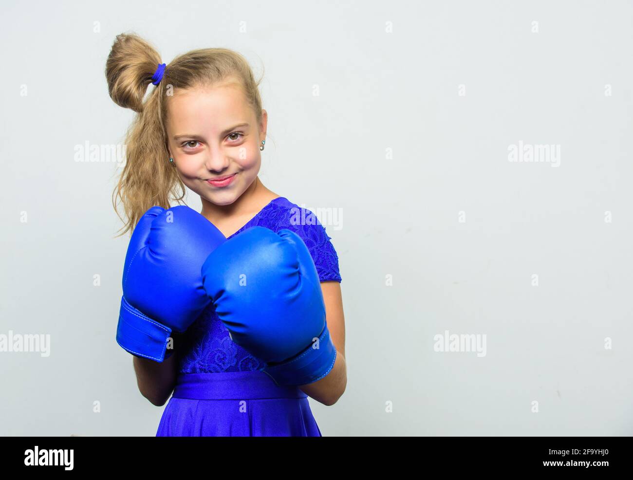 little girl in boxing gloves punching. knockout and energy. Sport ...