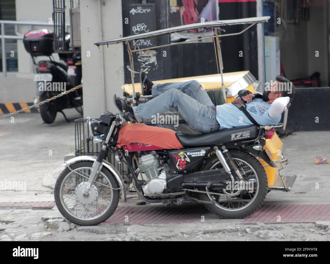 San Jose Del Monte, Philippines. 21st Apr, 2021. A tricycle driver take ...