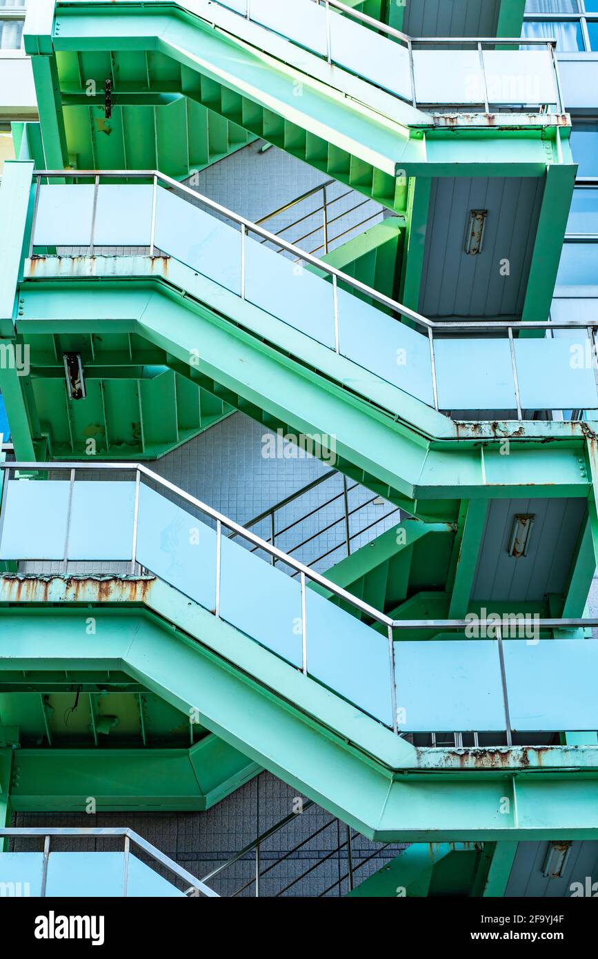 green fire escape ladders on building, Exterior view Stock Photo - Alamy