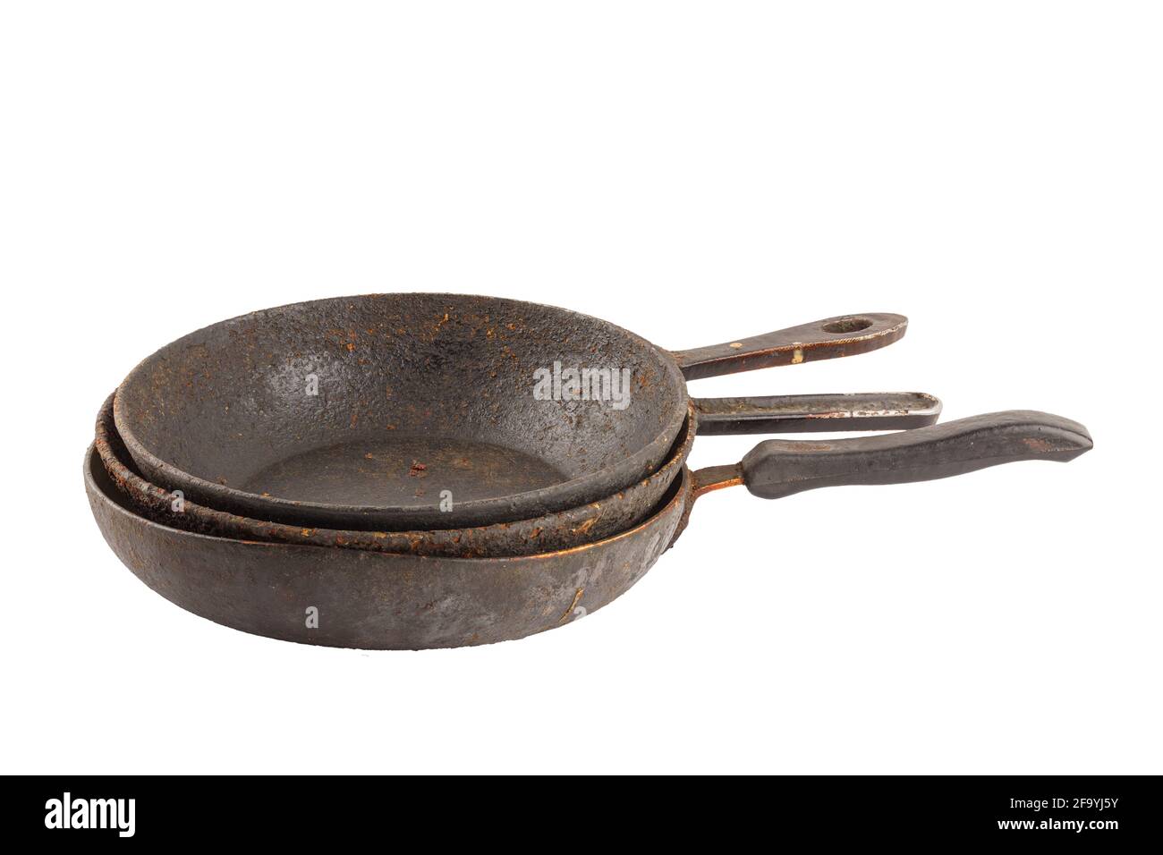 old disgusting stained rusty cast iron pan stack with burnt fat and ...