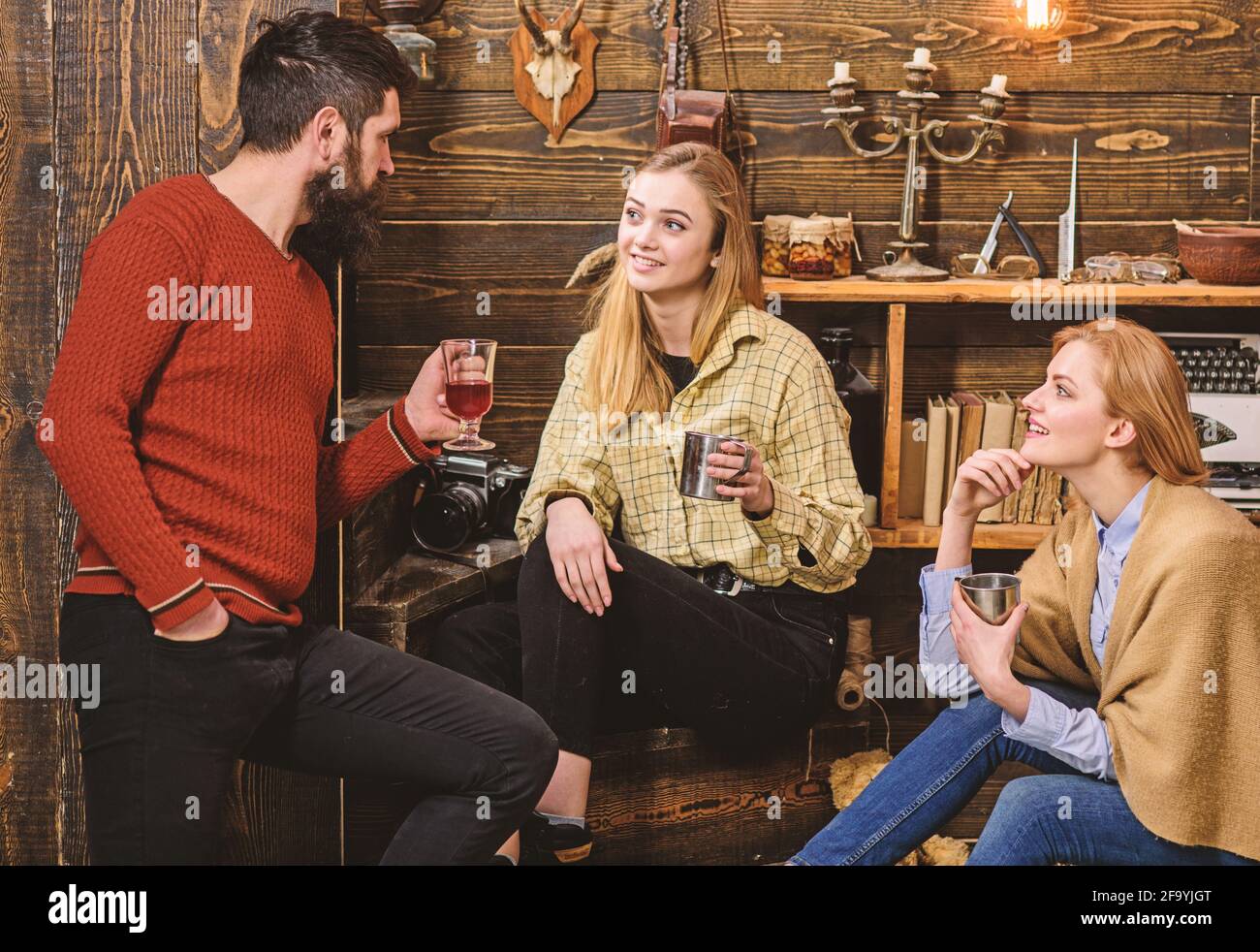 Family enjoy conversation in gamekeepers house. Sincere conversation ...