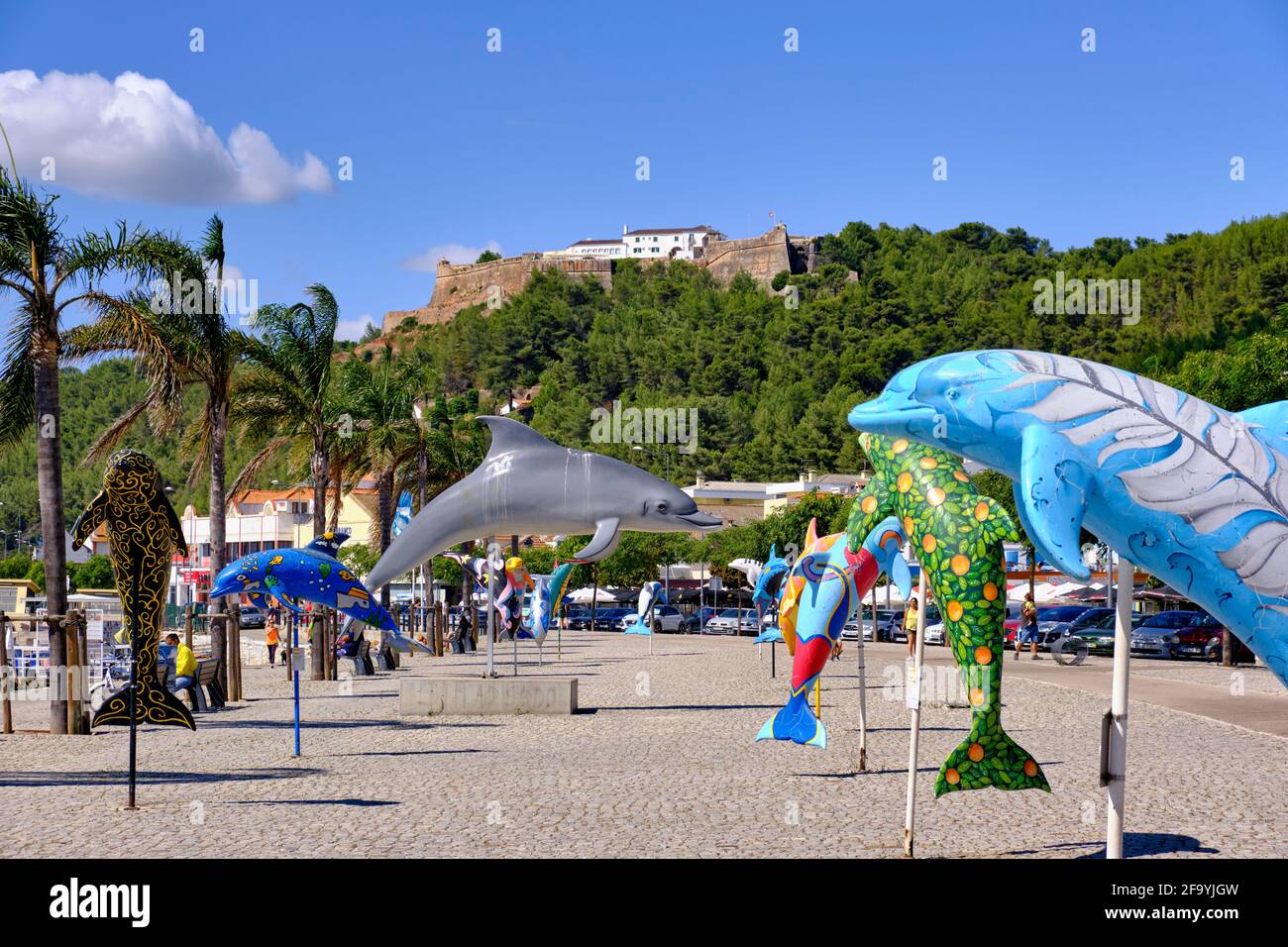 The Dolphins park near the fishing harbour of Setubal. The Sao Filipe ...