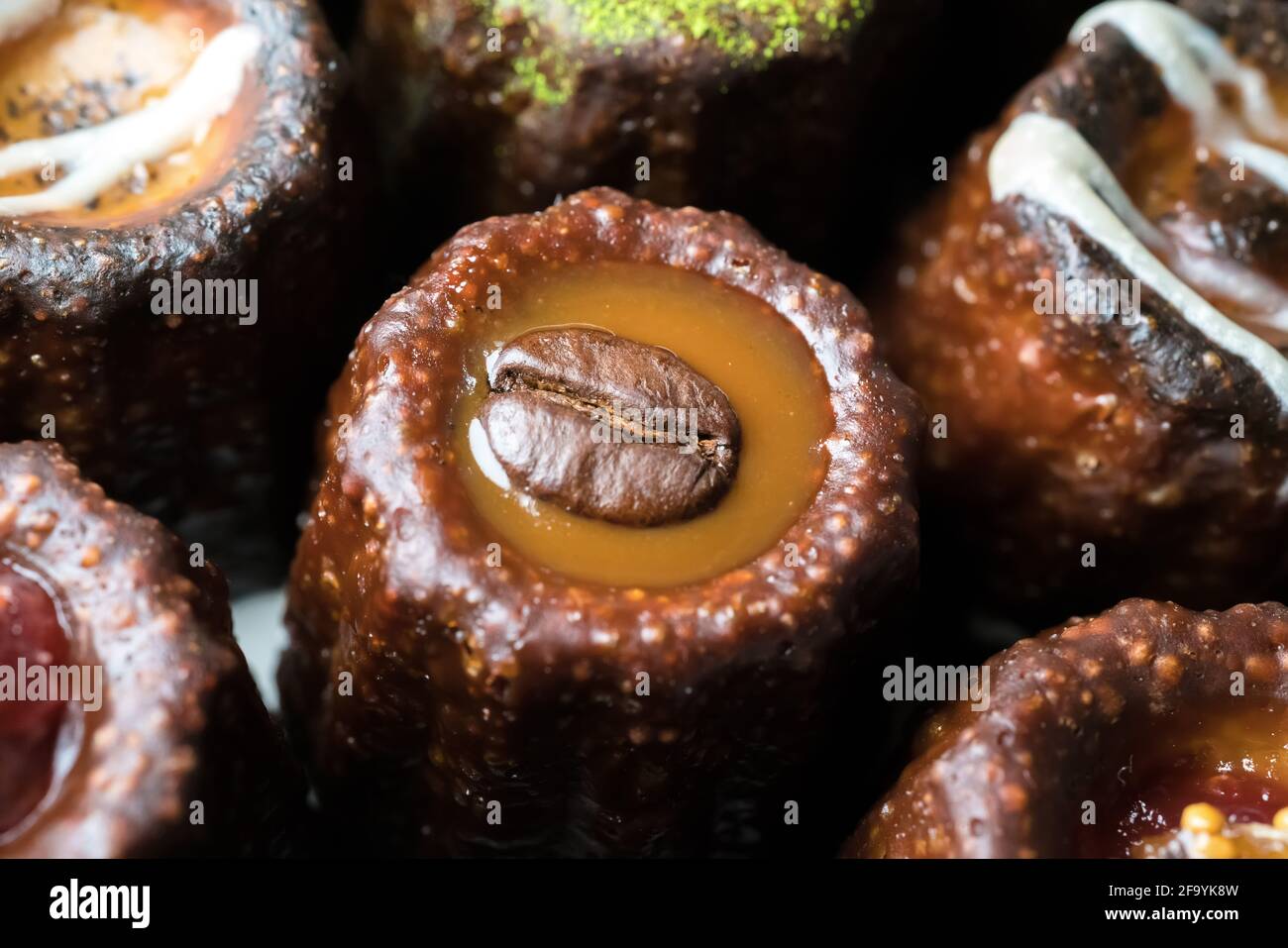 Caneles de bordeaux is a small pastry with rum and vanilla, traditional ...
