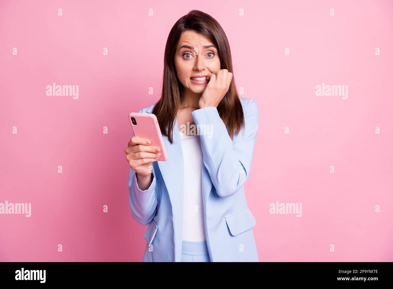 Photo of young beautiful woman bite fingers nervous panic fail dislike ...