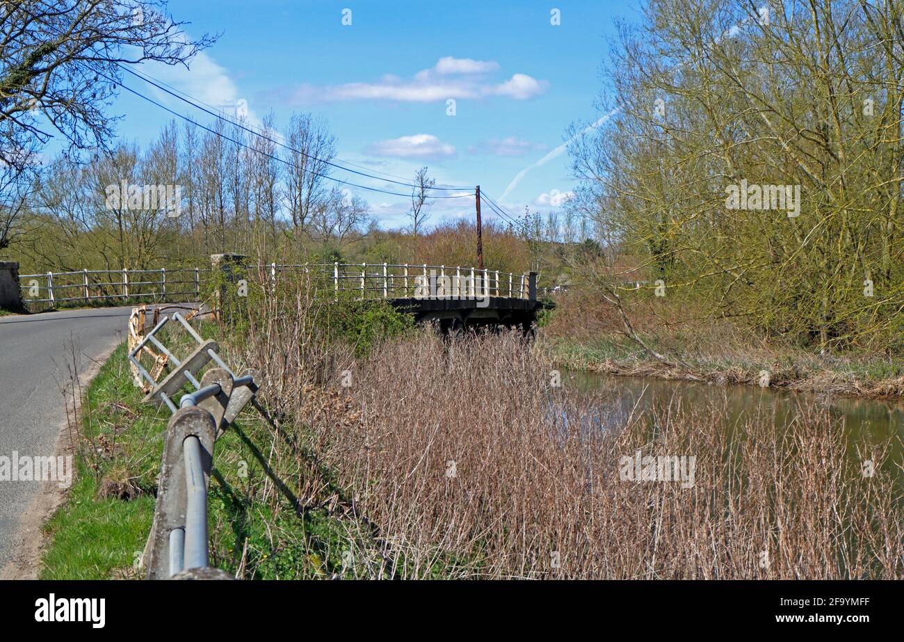 A road approaching a weak bridge over the River Wensum with damaged ... A road approaching a weak bridge over the River Wensum with damaged ...