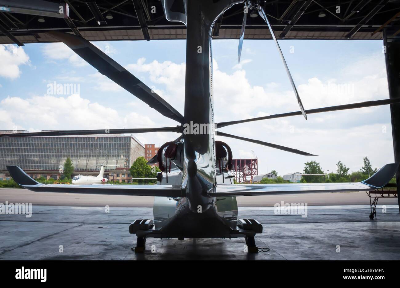 The helicopter is in the hangar. Back view Stock Photo - Alamy