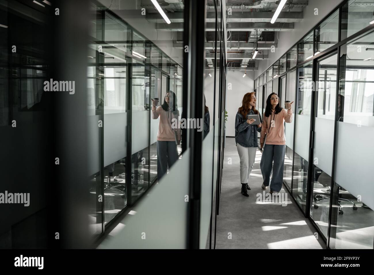 Young adult students walking college campus hi-res stock photography ...