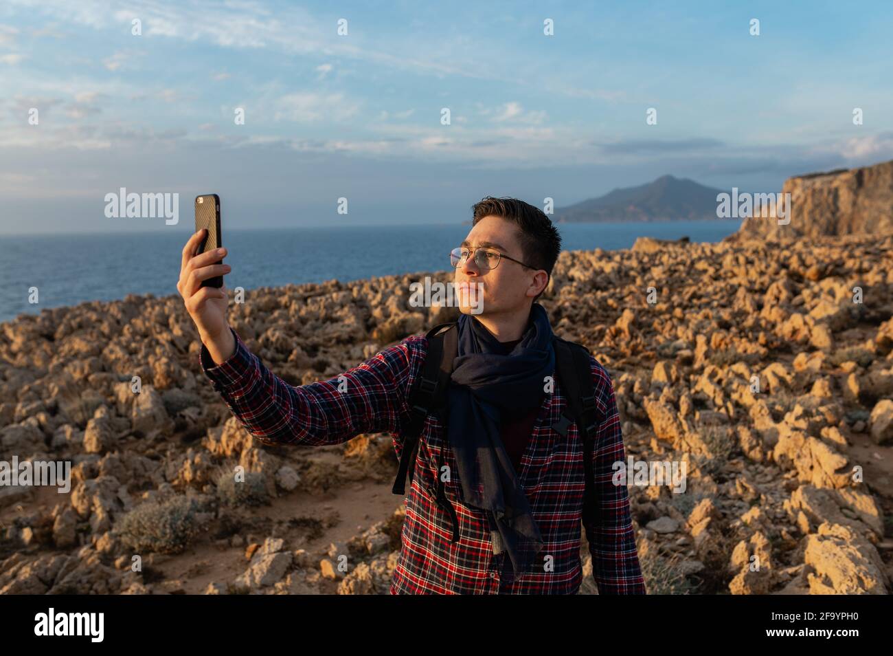 Guy holding a smartphone with poor mobile phone signal in a remote ...