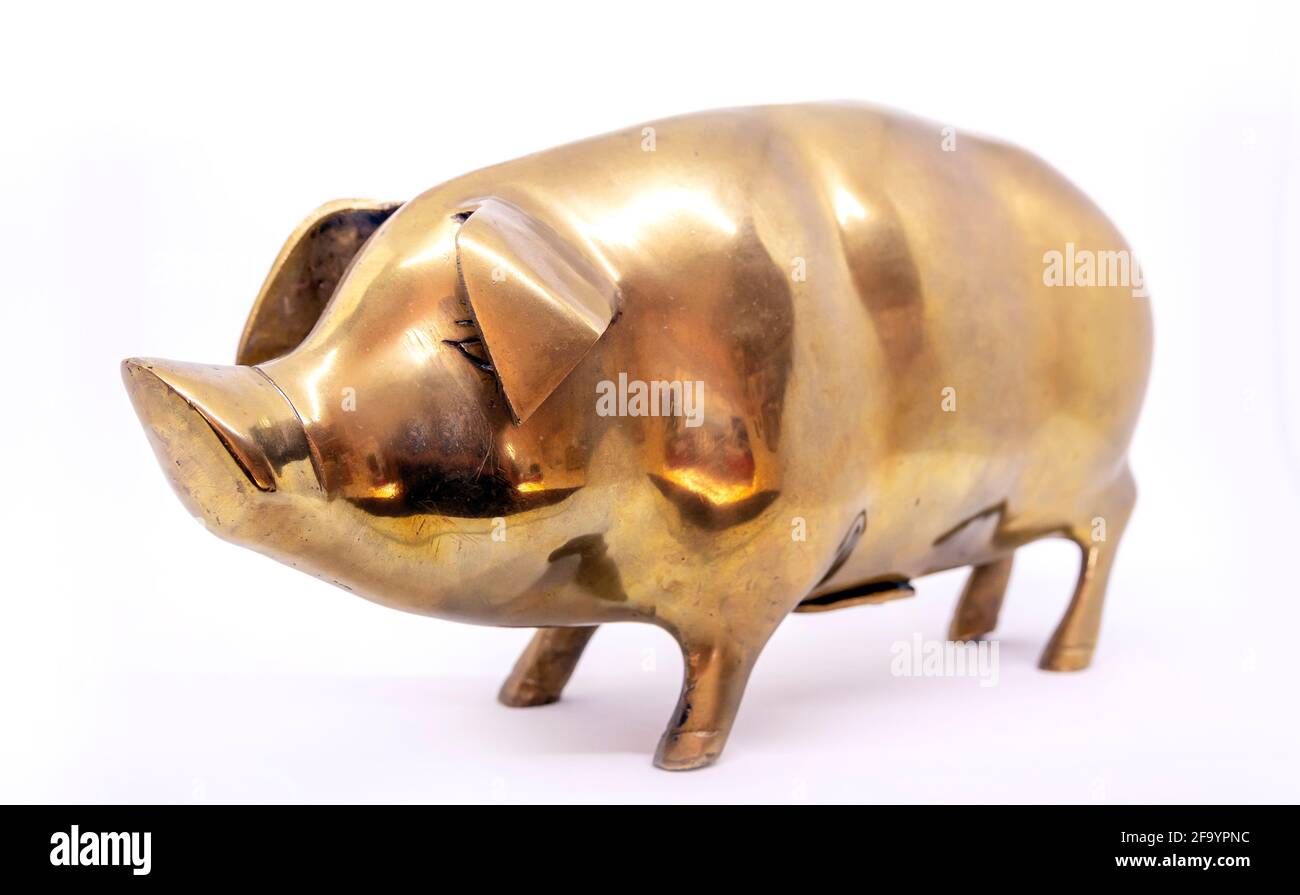Money saving concept: Golden metallic pig as coin safe box. Vintage ...