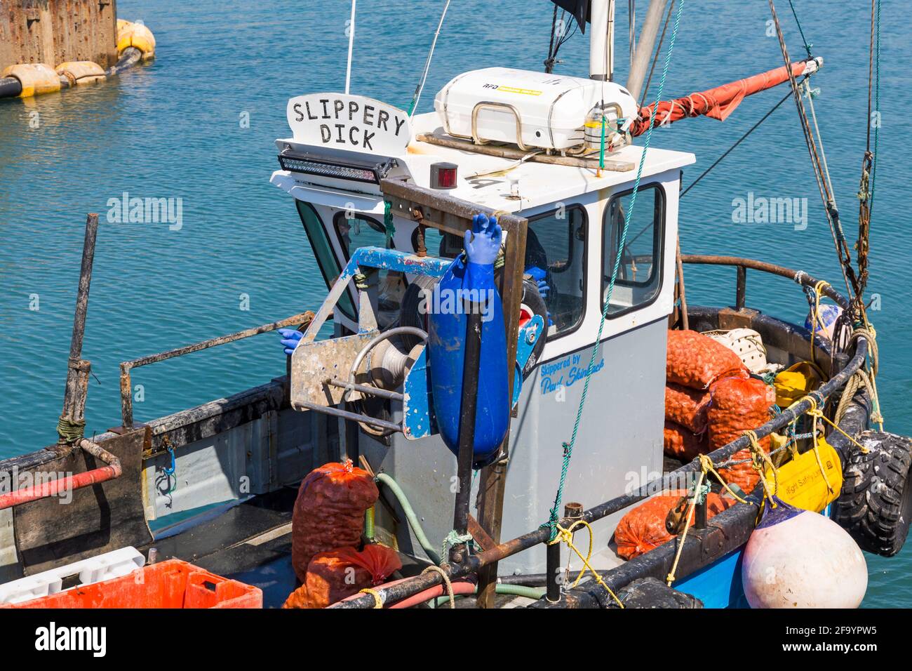 Slippery Dick fishing boat returning to harbour at Lyme Regis, Dorset ...