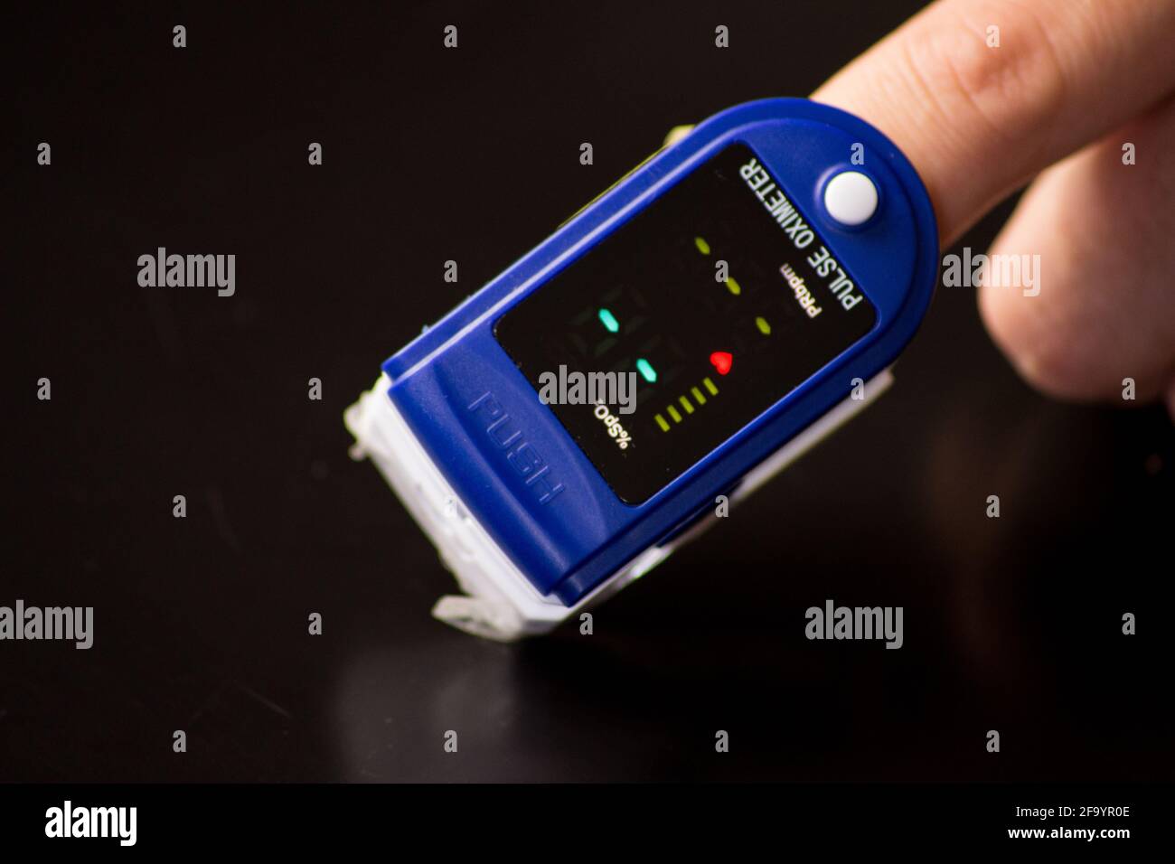 Pulse oximeter with hand of patient. Pulse Oximeter portable digital ...