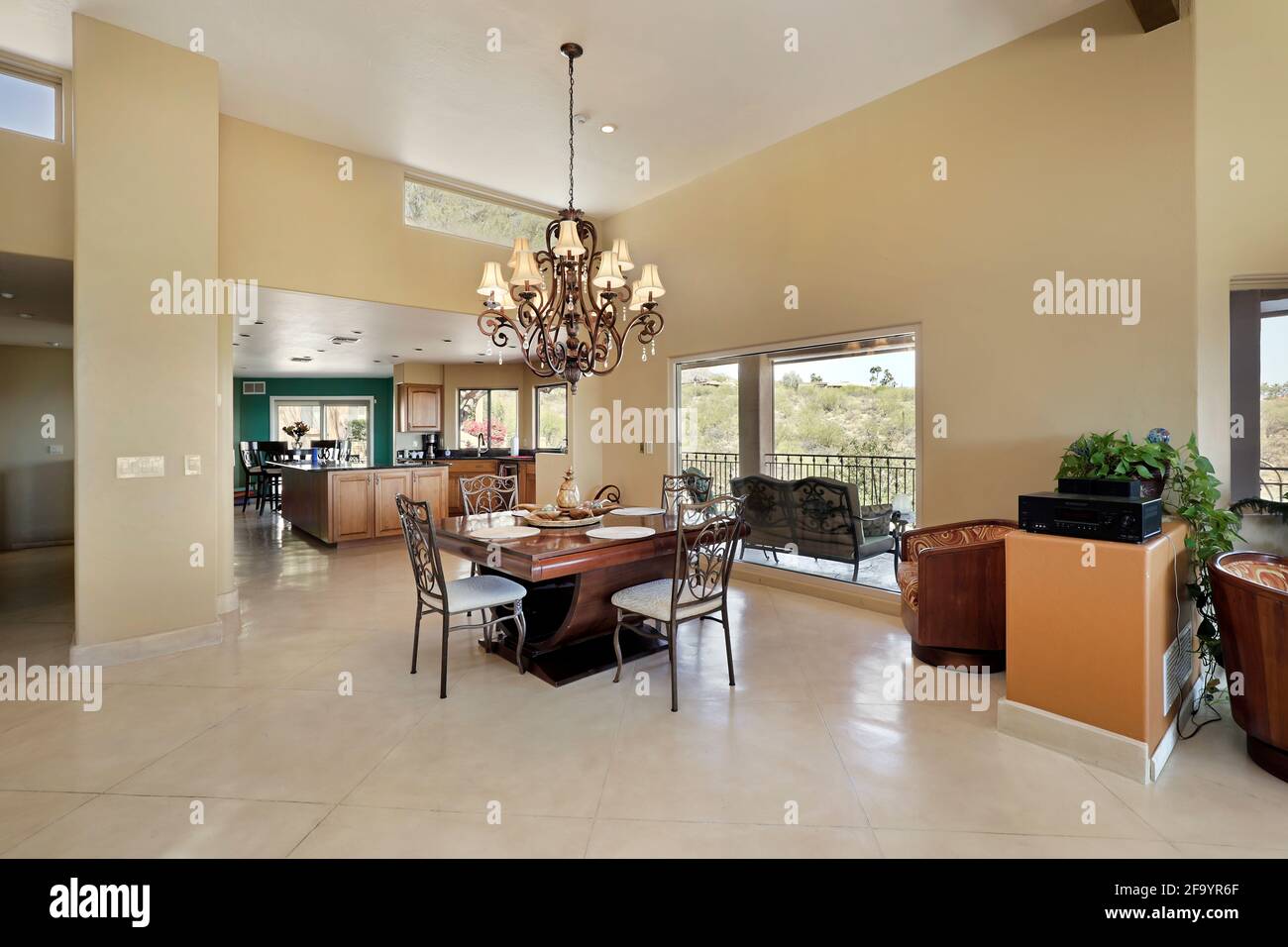 Eating area in luxury home with picture windows Stock Photo - Alamy