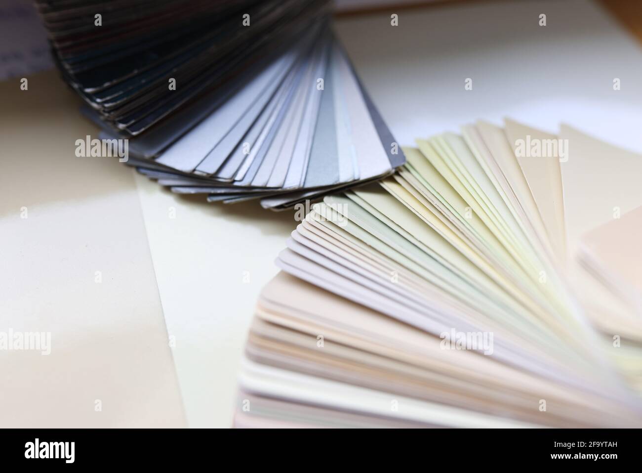 Multi-colored color palettes with swatches lie on table Stock Photo - Alamy