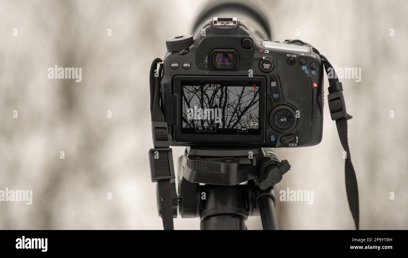 Digital camera set up in a landscape for shooting the beautiful view of ...