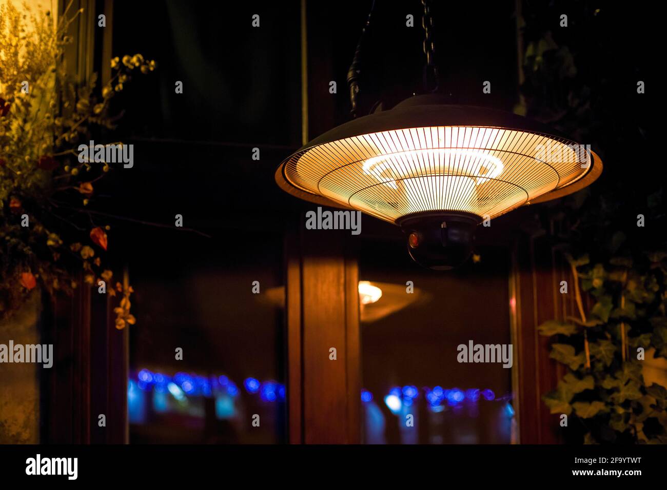 pendant heater glowing with warm light and radiating warmth by the ...