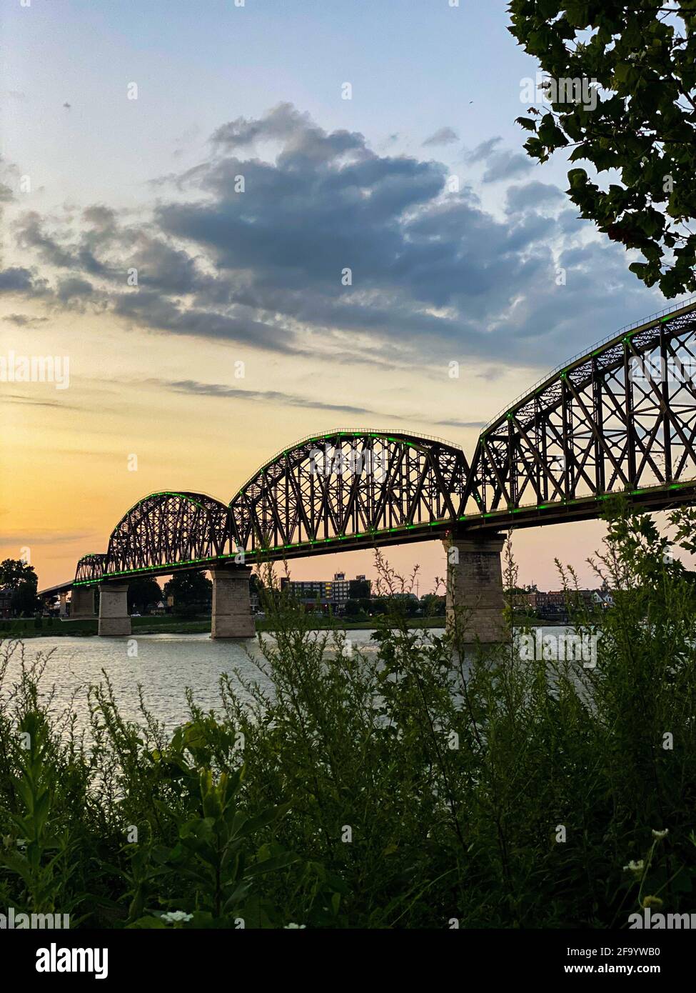 Side shot of a metal bridge with sky background Stock Photo - Alamy