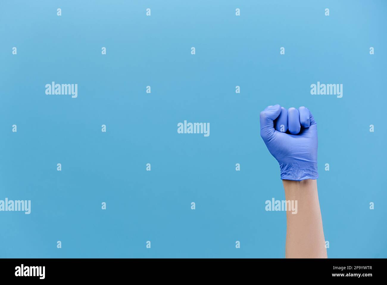 Close up of male hand in medical protection latex gloves knock knock ...
