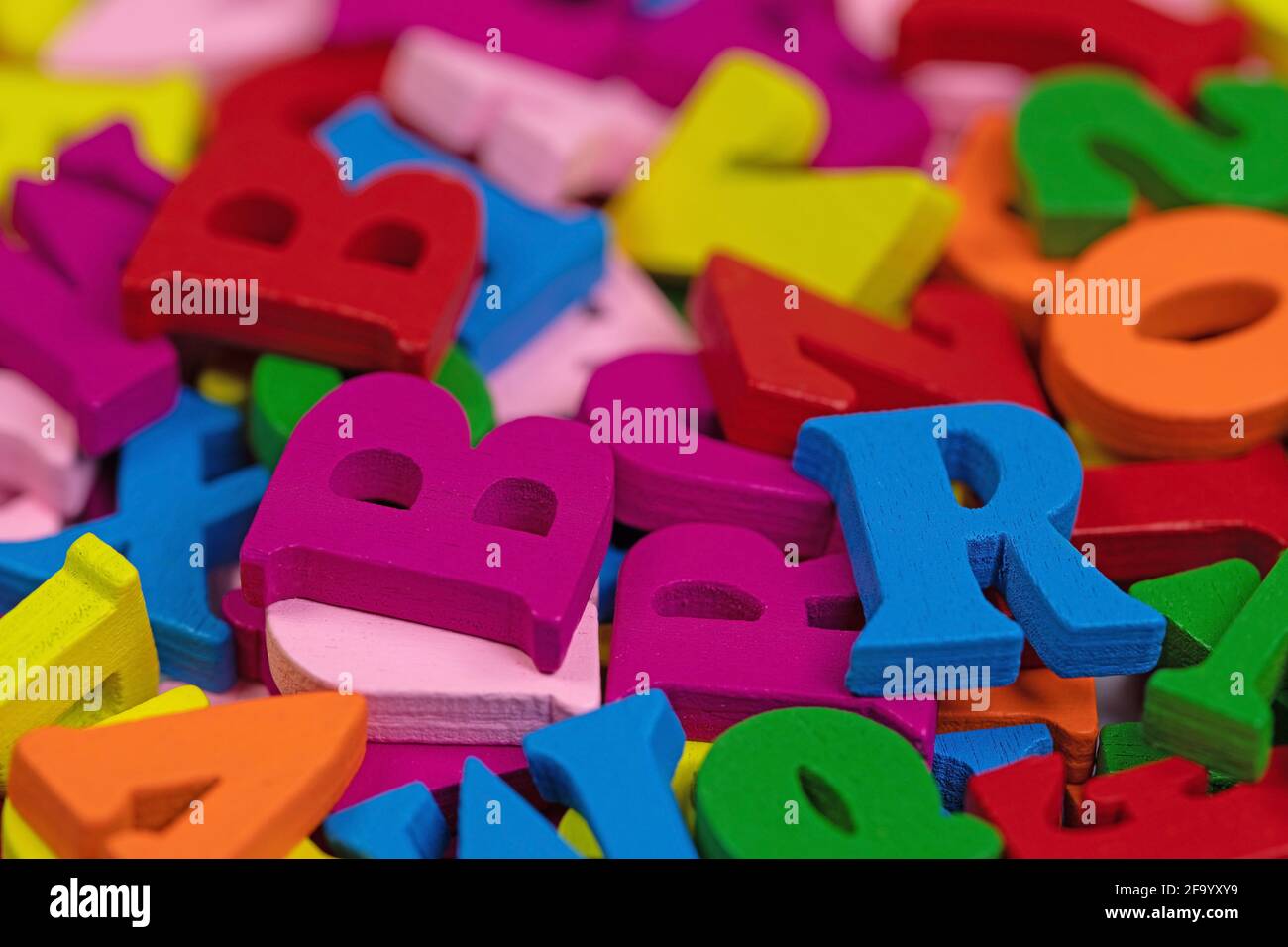 Colorful wooden letters in a close-up Stock Photo - Alamy