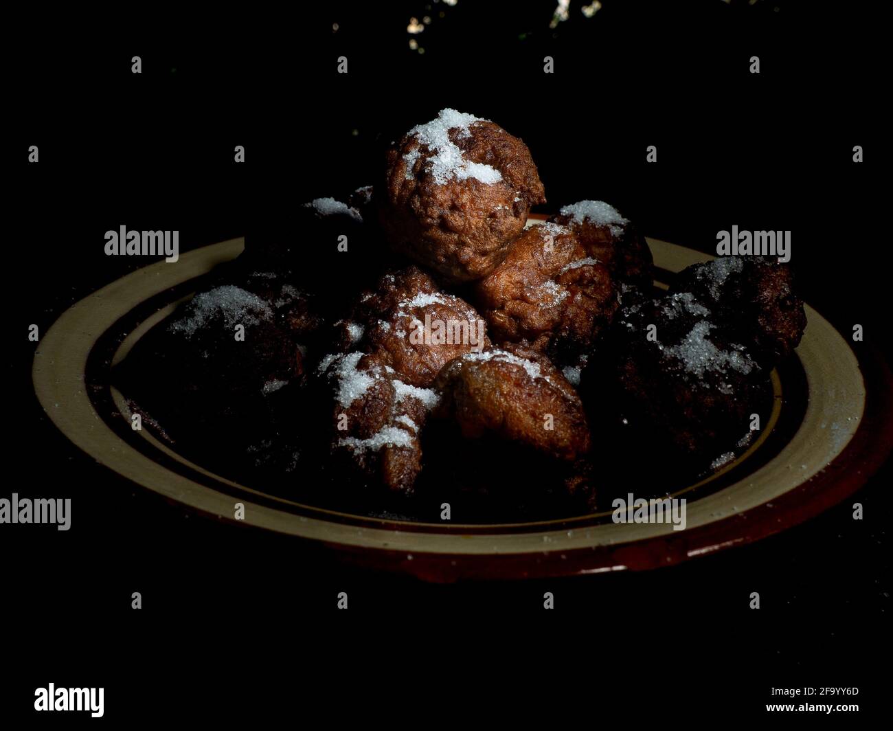 Wind fritters with sugar Stock Photo - Alamy