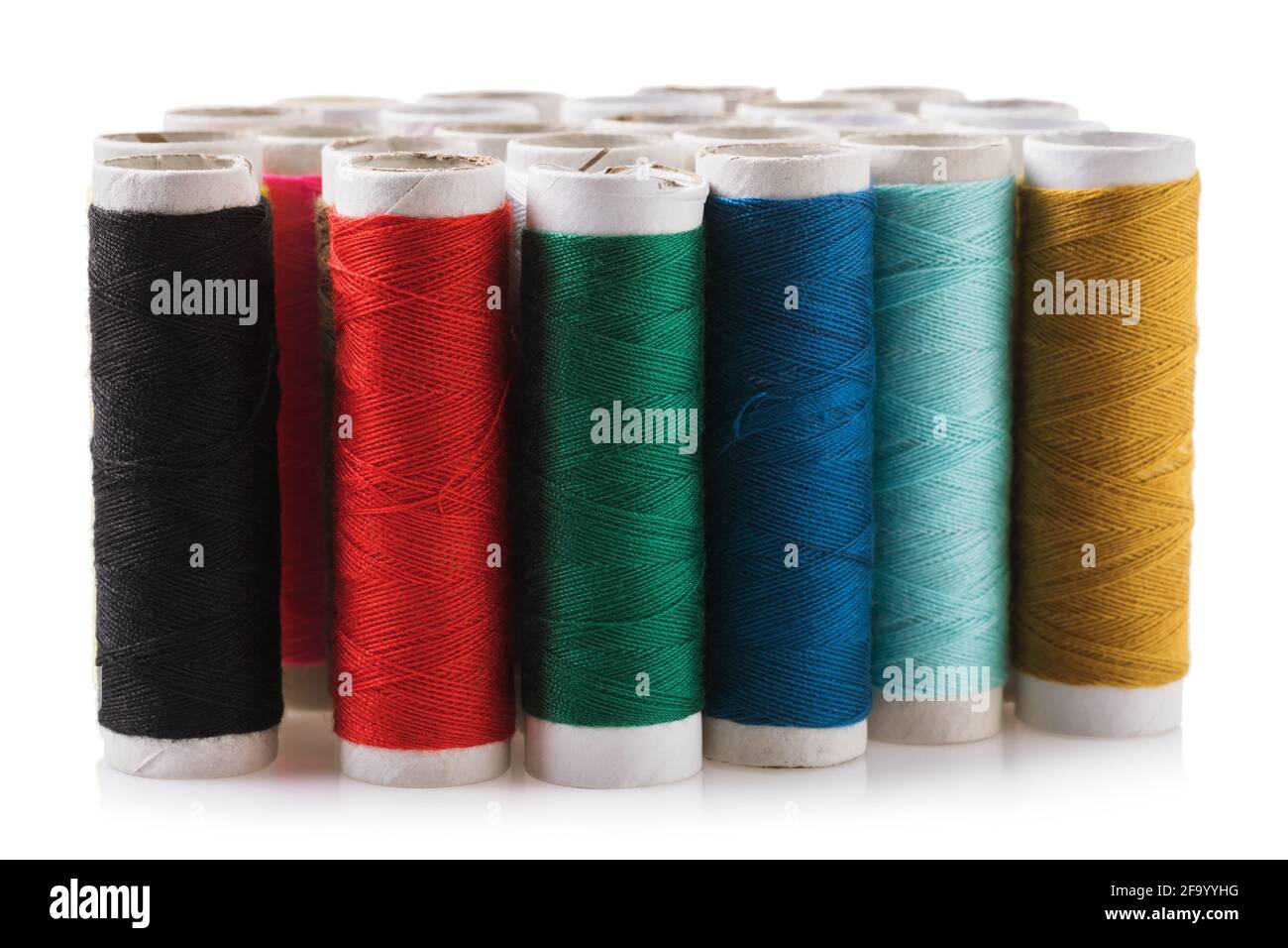 Set of spools with multicolored threads isolated on white background ...