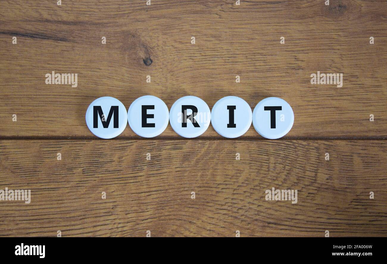 Merit symbol. Wooden white circles with the word 'merit'. Beautiful ...