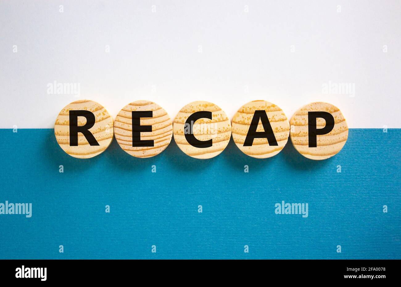 Recap symbol. Wooden circles with word 'recap' on beautiful white and ...