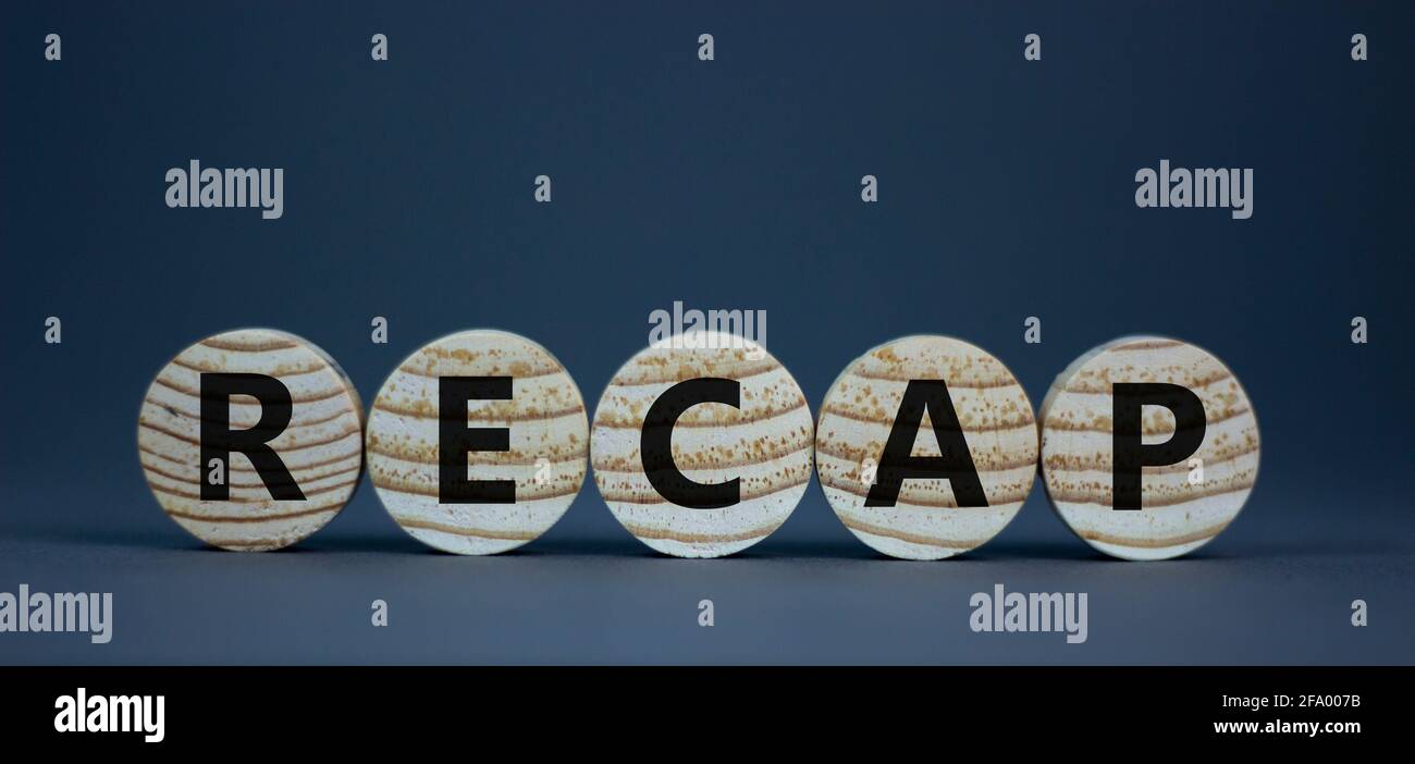 Recap symbol. The word 'recap' on wooden circles on beautiful grey ...