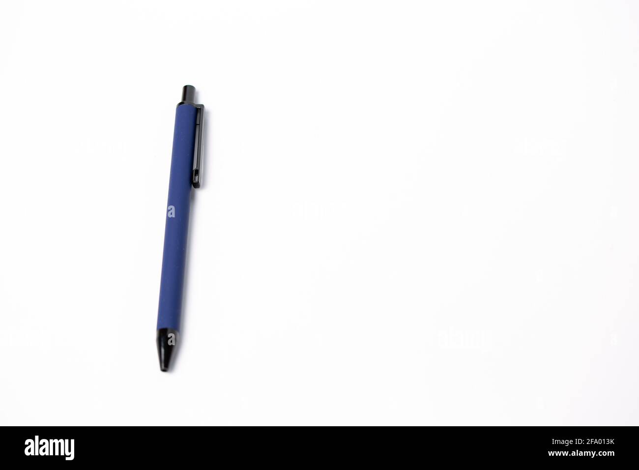 Blue pen isolated on a white background Stock Photo - Alamy