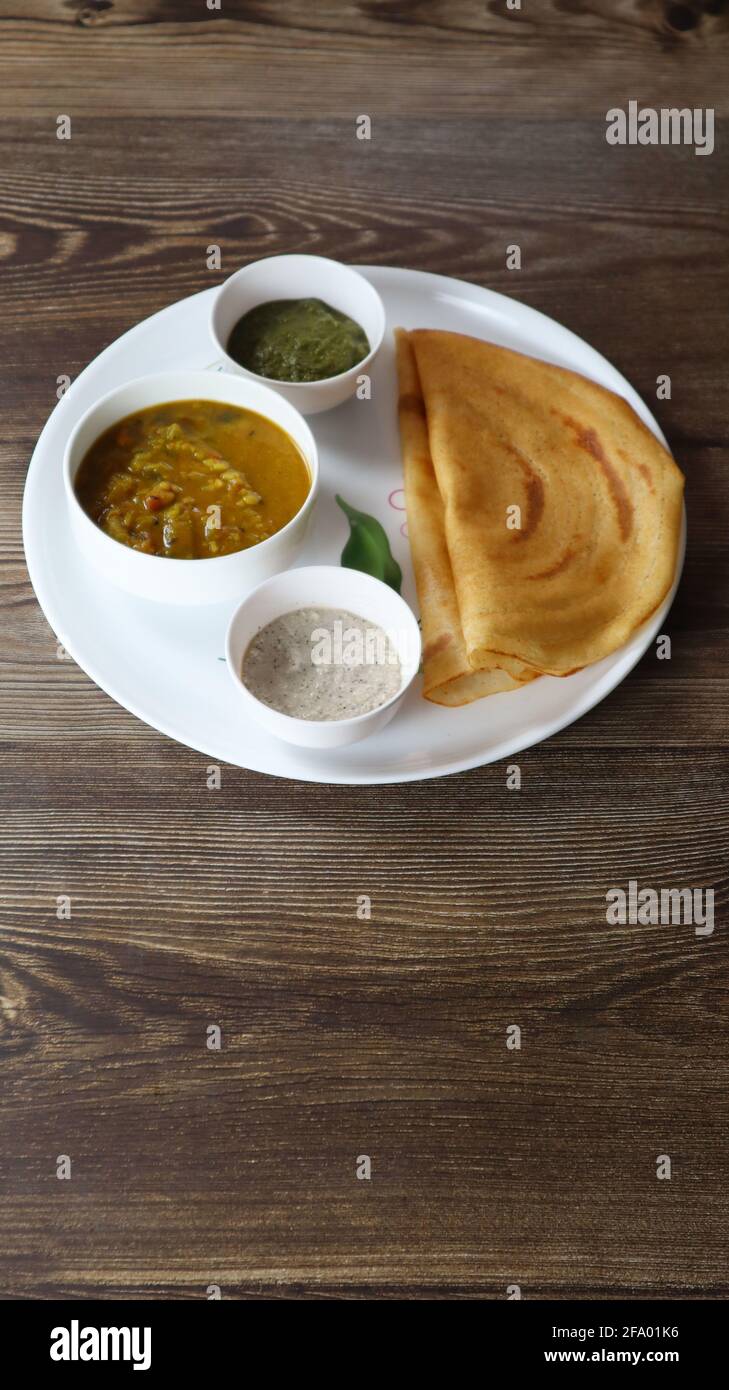 Dosa (Thin Pancake or crepe,) is a South Indian meal served with ...