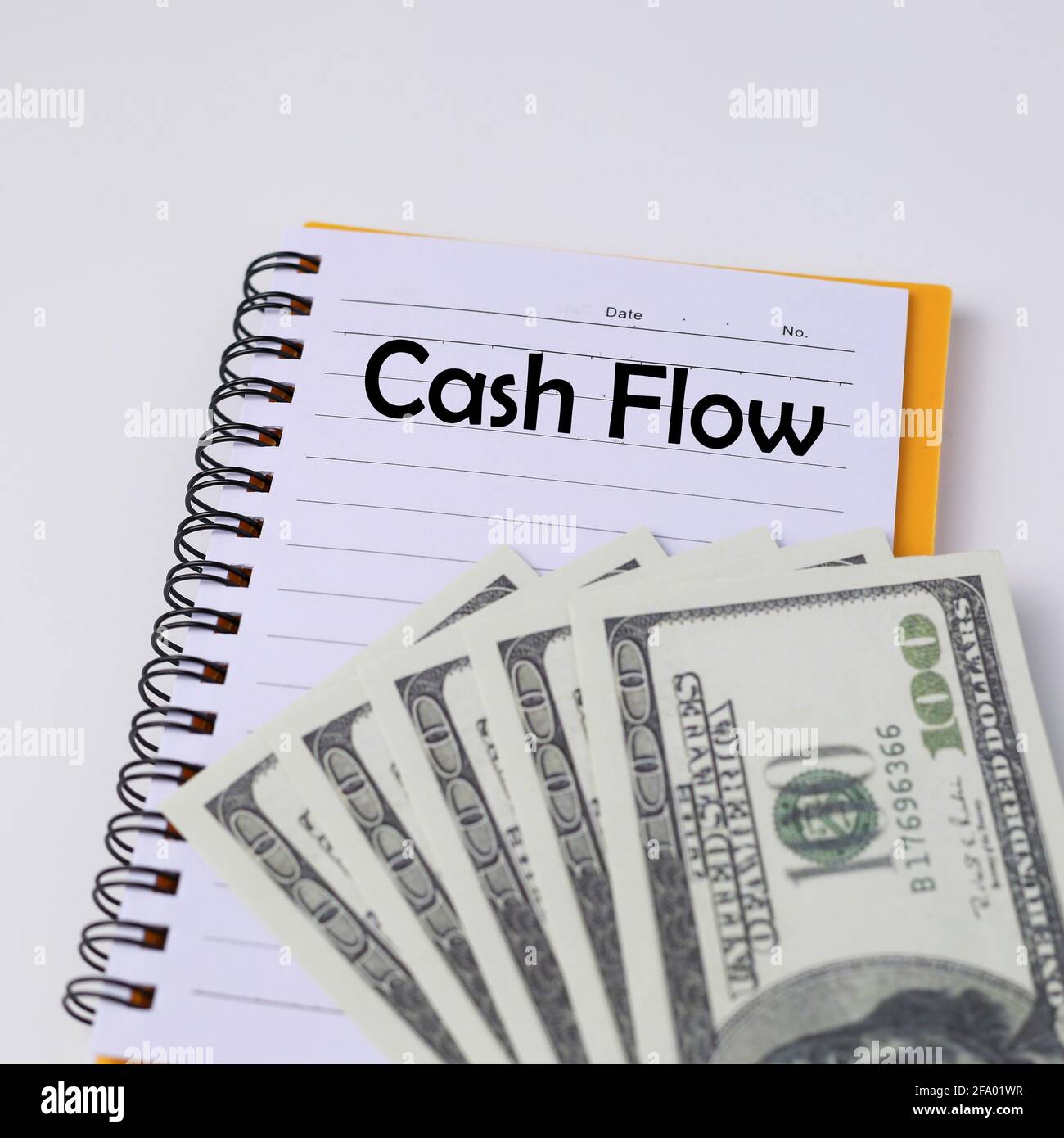 Cash flow written on a notebook Stock Photo - Alamy