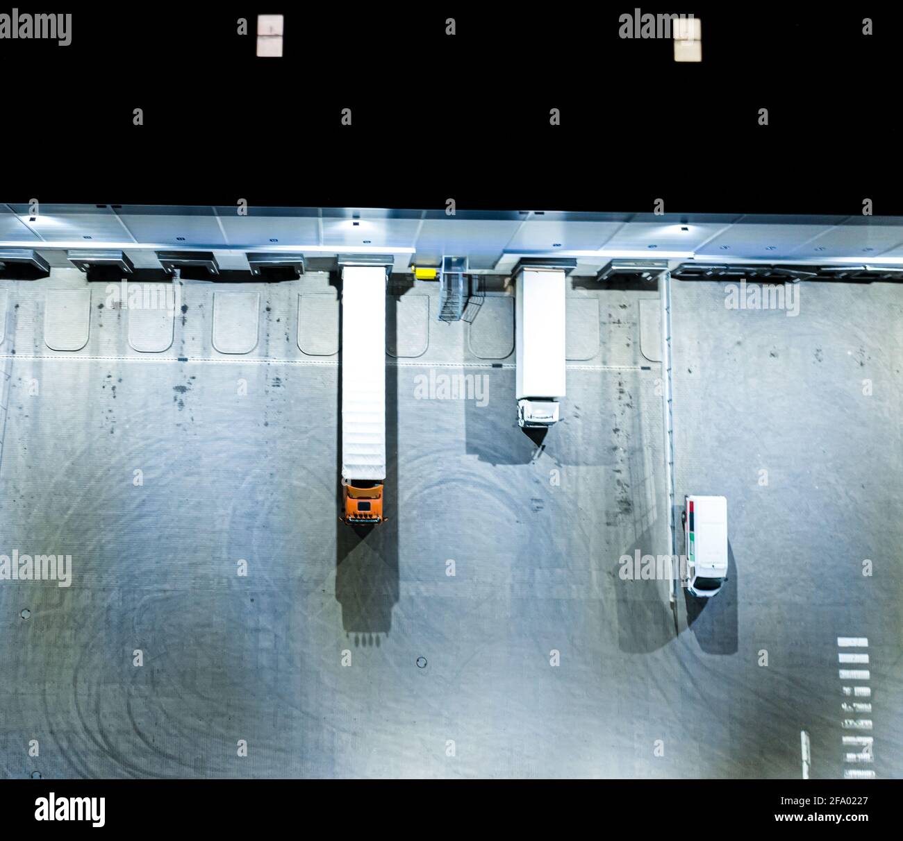Night Aerial view of goods warehouse. Logistics center in industrial ... Night Aerial view of goods warehouse. Logistics center in industrial ...