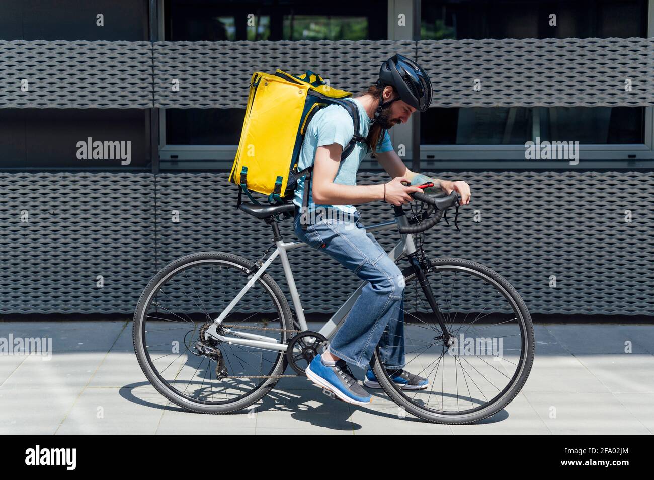 Smart food delivery courier on bike hi-res stock photography and images ...