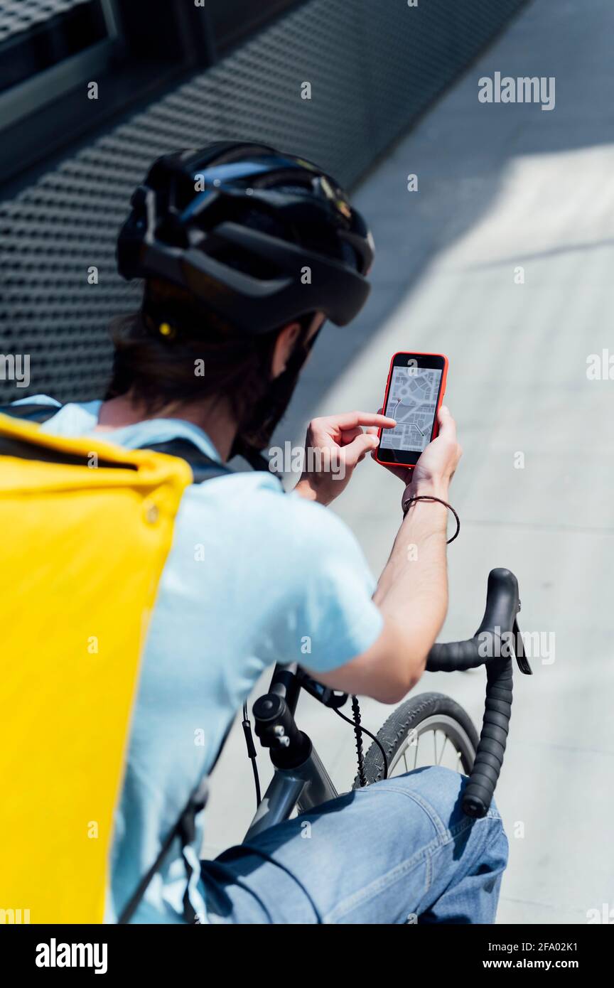 man on bike with smartphone map app Stock Photo - Alamy