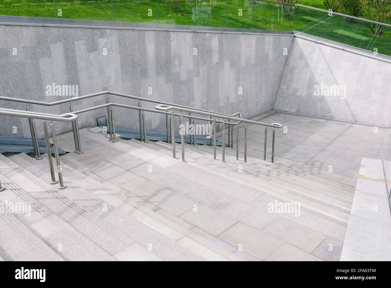 Gray staircase with a ramp for the disabled. Urban architecture. Exit ...