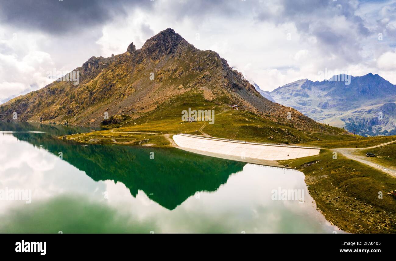 Inspiring alpine landscape with beautiful calm lake with dam Stock ...