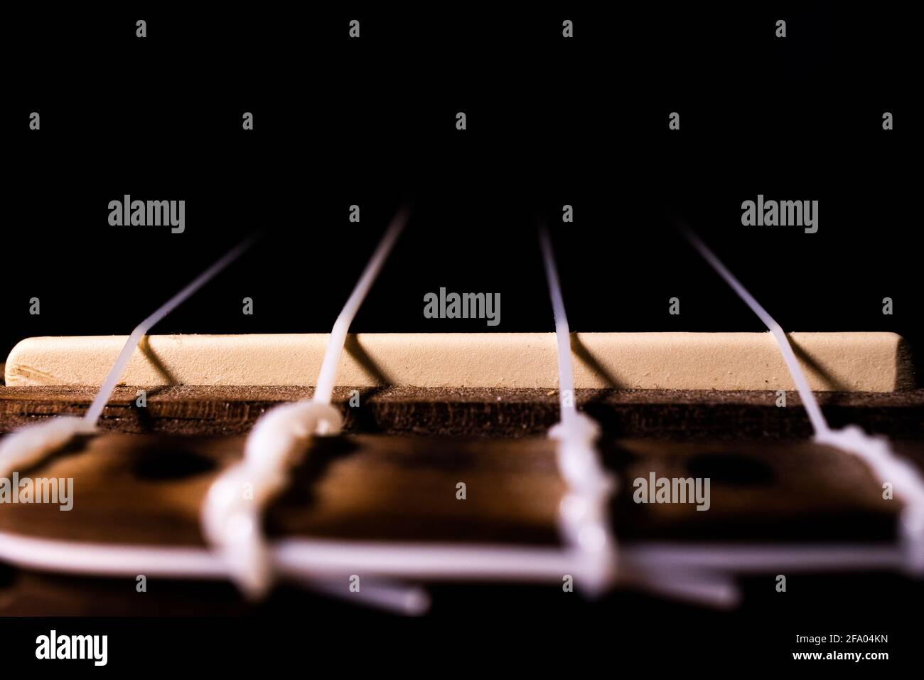 Ukulele close up bridge strings hi-res stock photography and images - Alamy