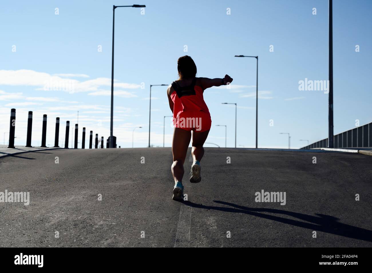 runner woman running from behind Stock Photo - Alamy