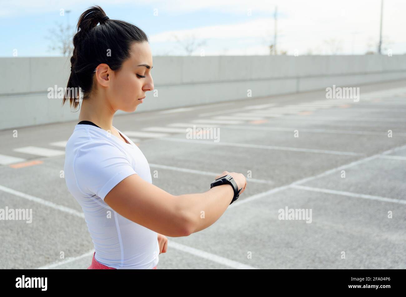 Woman looking at watch hi-res stock photography and images - Alamy