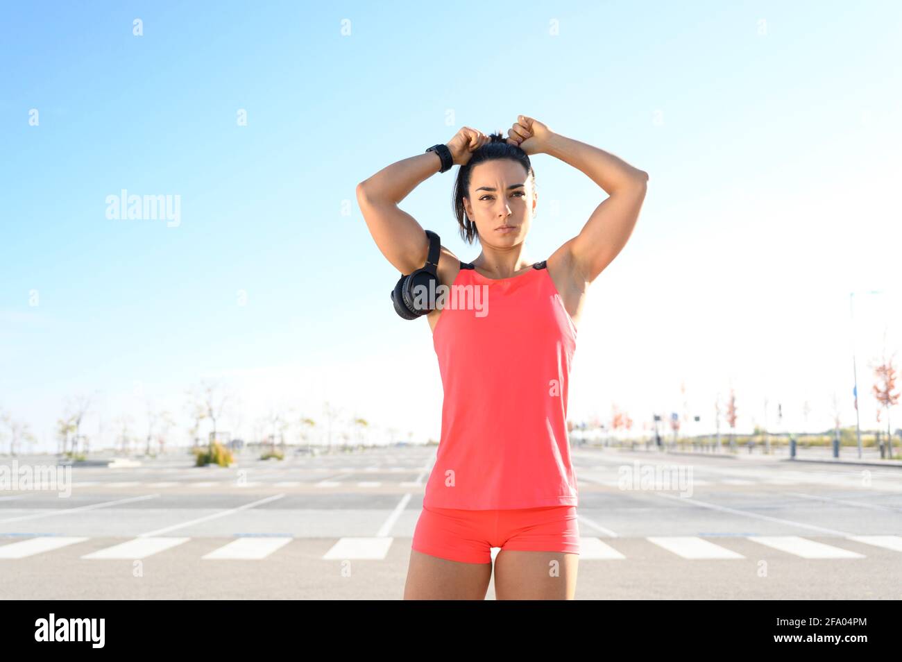 Female athlete getting her hair ready Stock Photo - Alamy