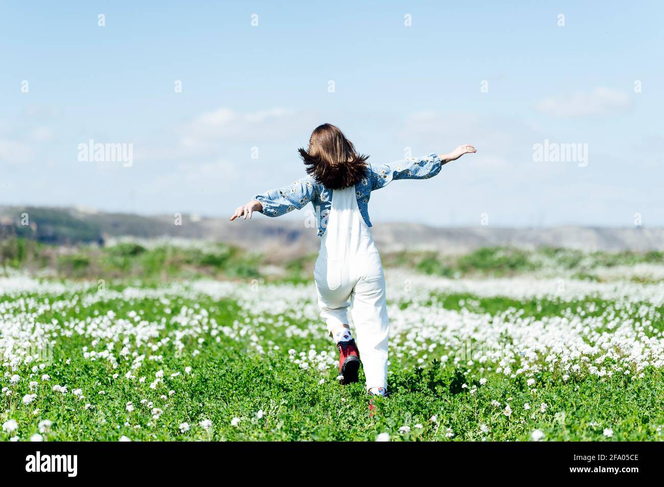 woman running through the green field Stock Photo - Alamy