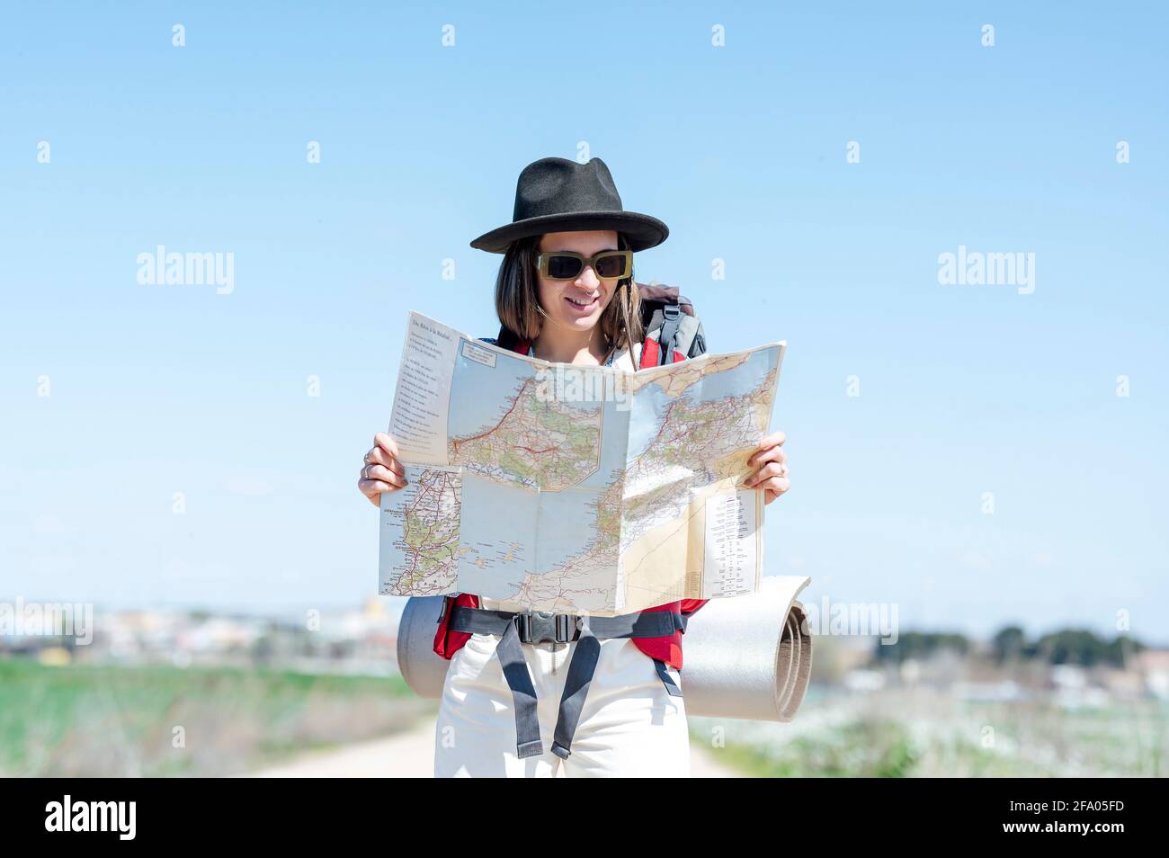 woman looking at a map travel and explore concept Stock Photo - Alamy