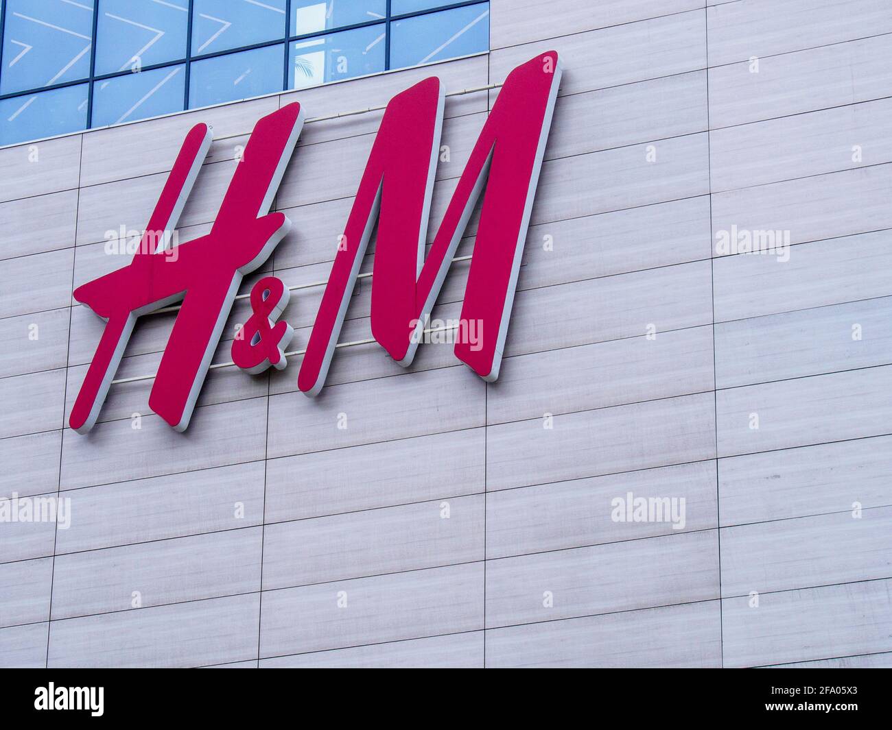 The H&M logo seen on the façade of the mall in Moscow Stock Photo - Alamy