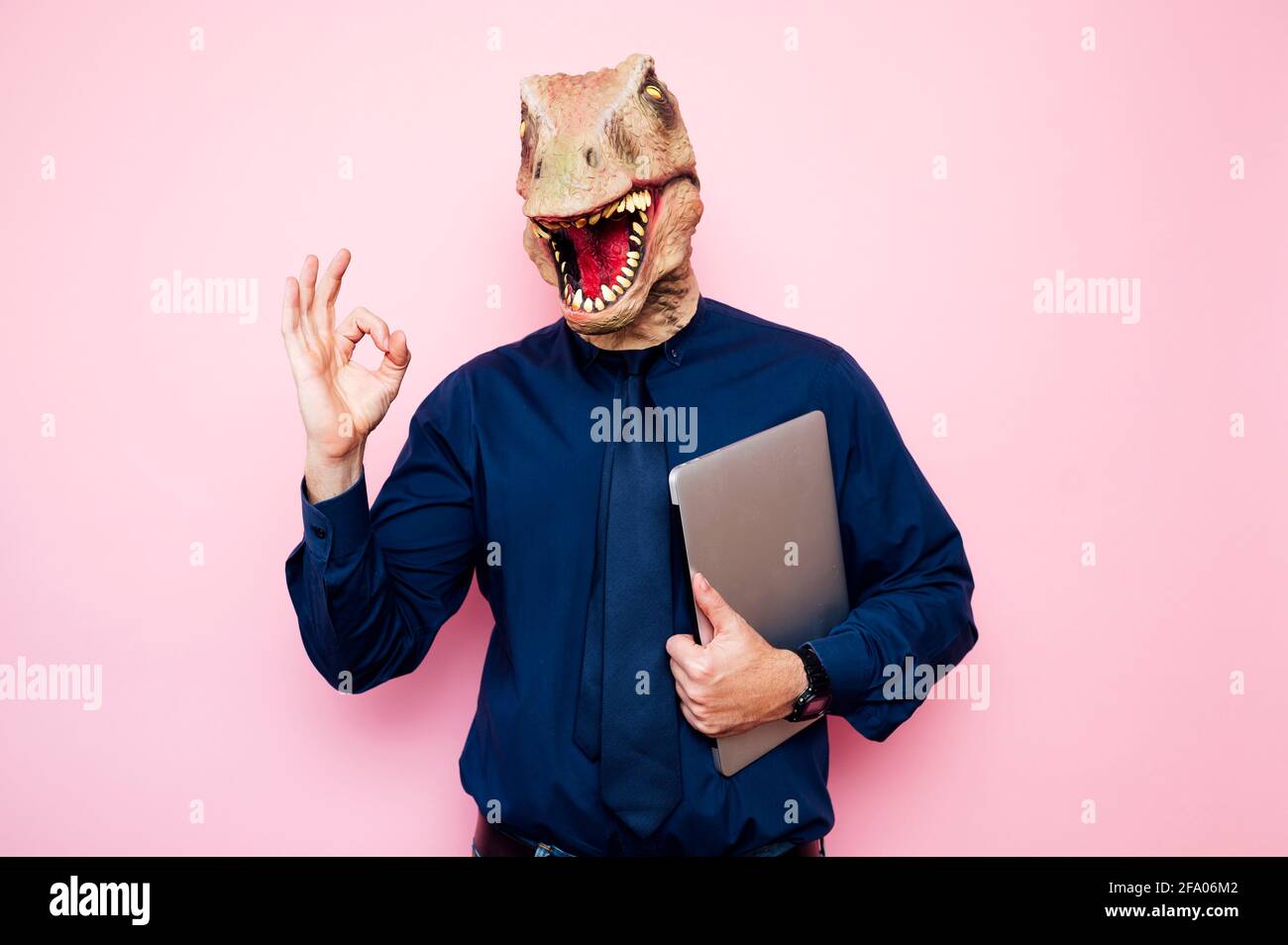 Man with euphoric dinosaur head and fingers with ok symbol Stock Photo ...