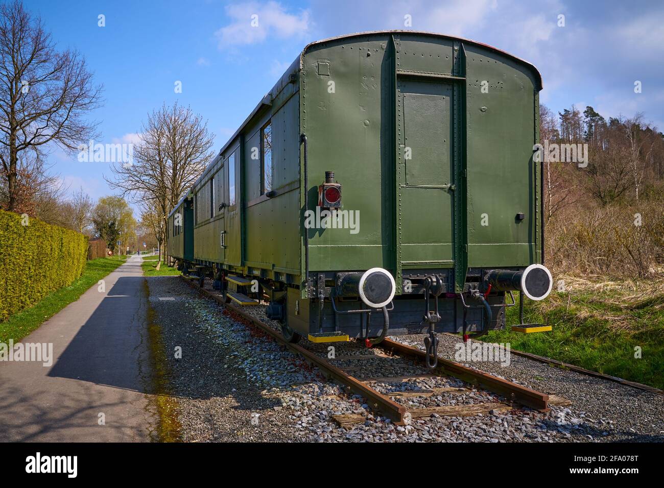 Oldtimer Train with steam engine from behind on a small track near ...
