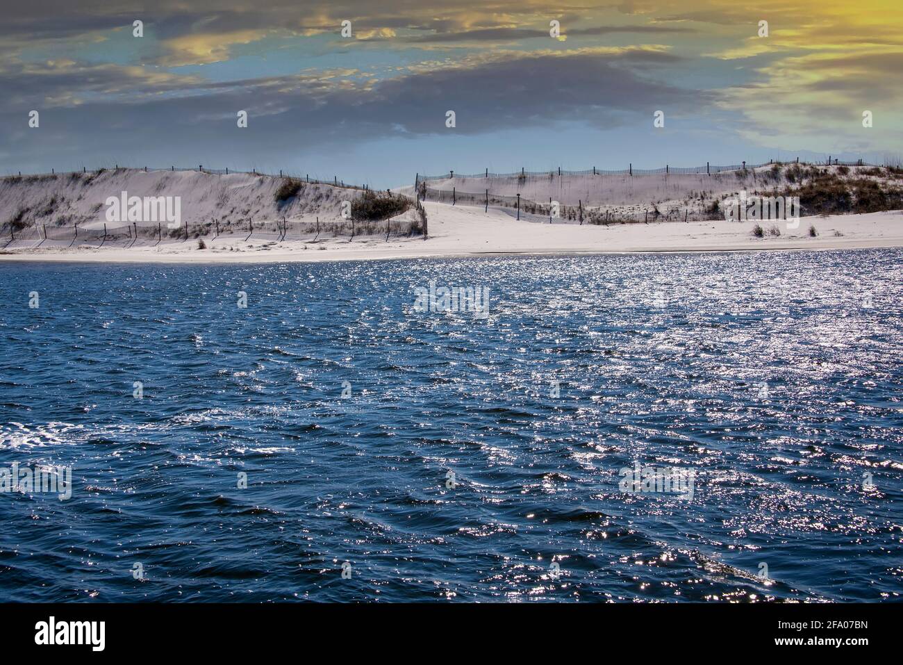 Sun setting over a beach in Destin, Florida and the Gulf of Mexico ...