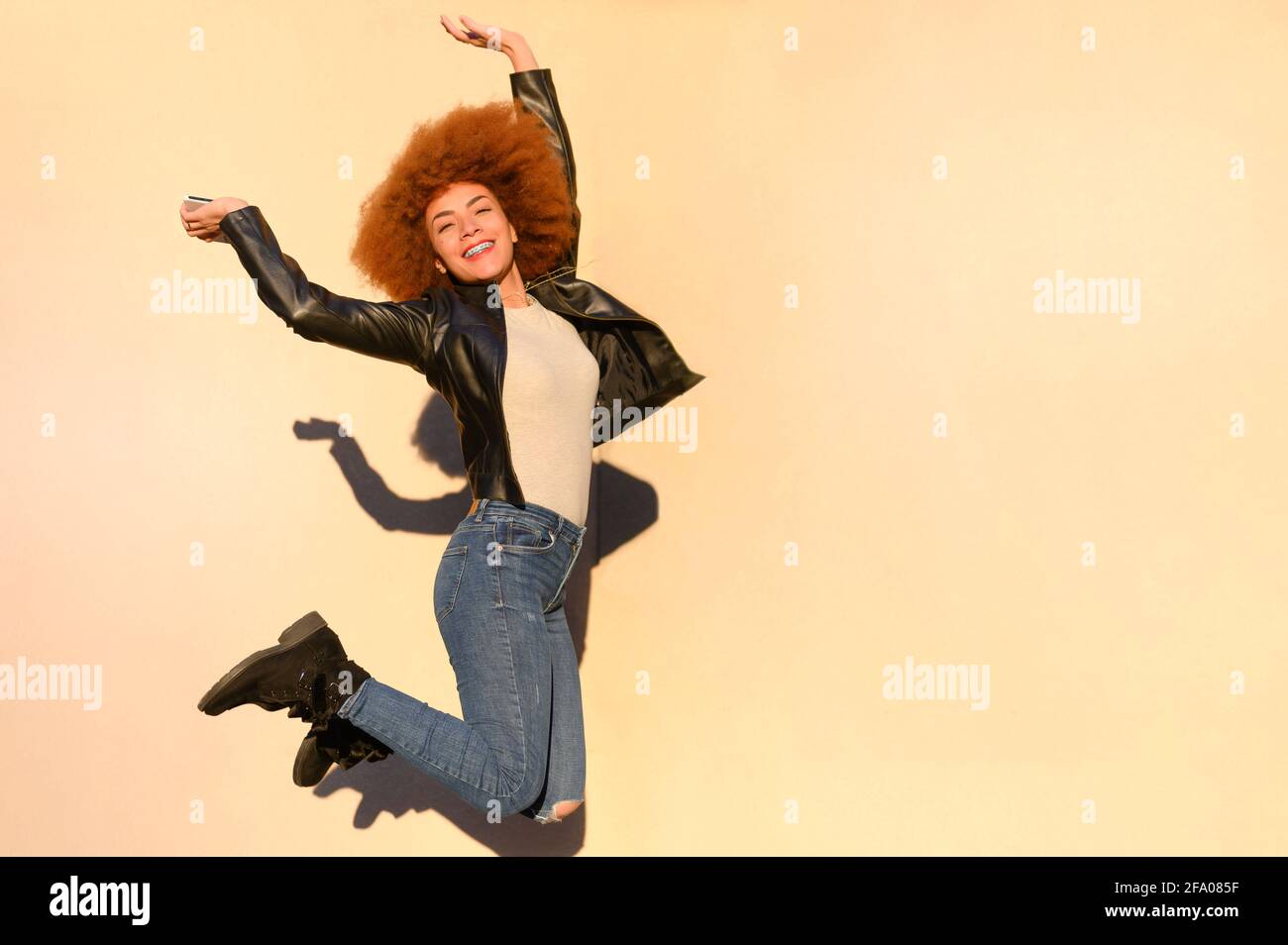 Woman phone jumping hi-res stock photography and images - Alamy