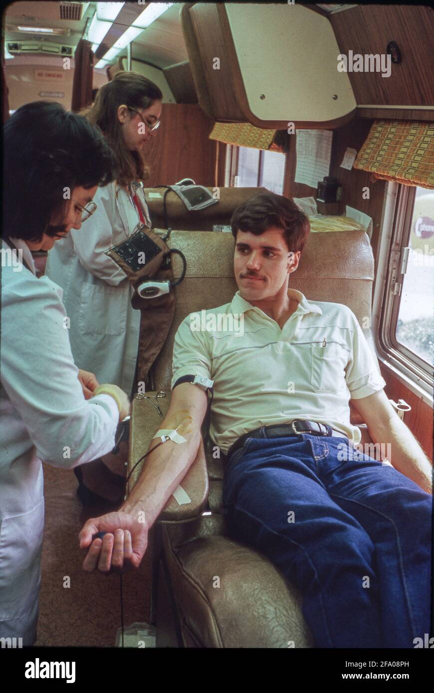 Austin, TX USA: Student donating blood at mobile donation center on ...